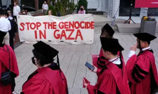 Students walk out in protest at Harvard commencement