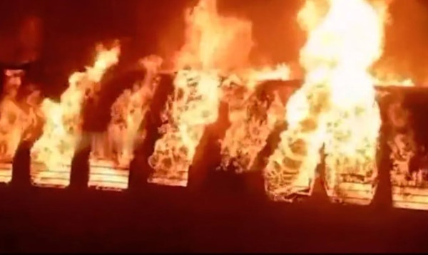 At least 10 killed as train coach catches fire in India
